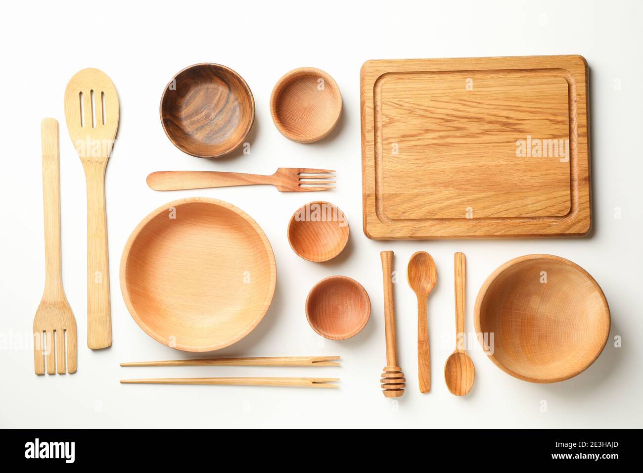 Different wooden dishes on white background, top view Stock Photo - Alamy