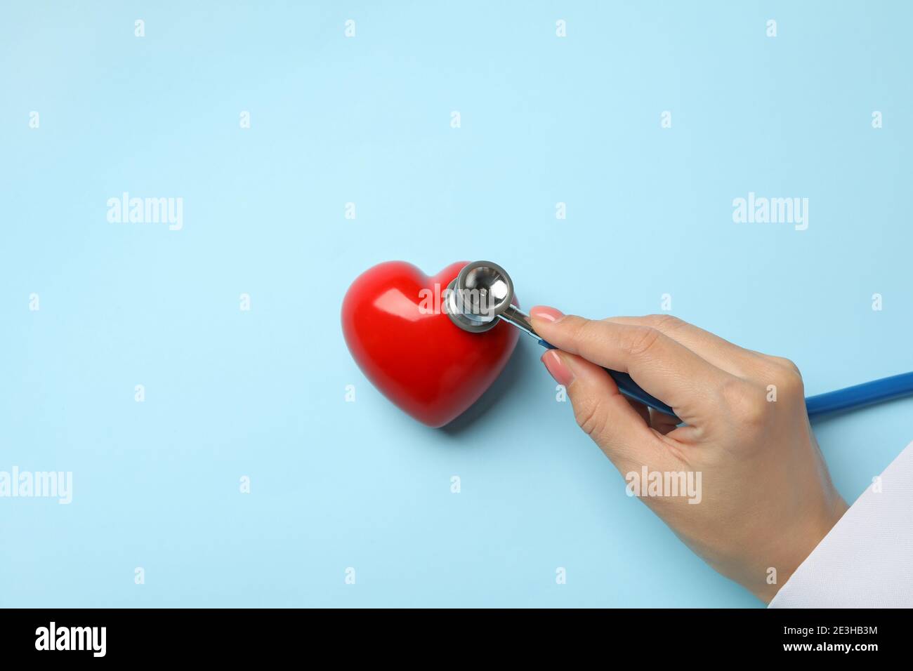 Female hand with stethoscope checking heart beat Stock Photo - Alamy