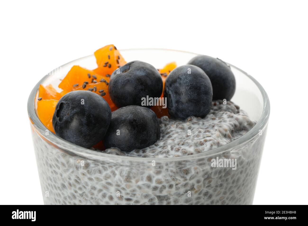 Glass of chia pudding with fruits isolated on white background Stock ...
