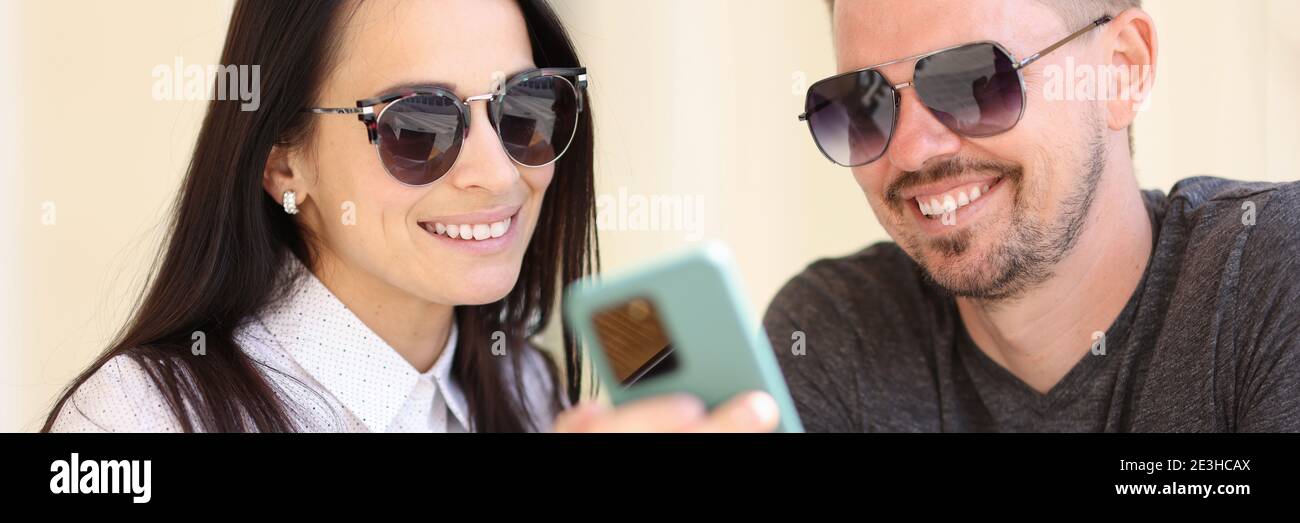 Adult modern fashion people look at smartphone screen portrait Stock ...