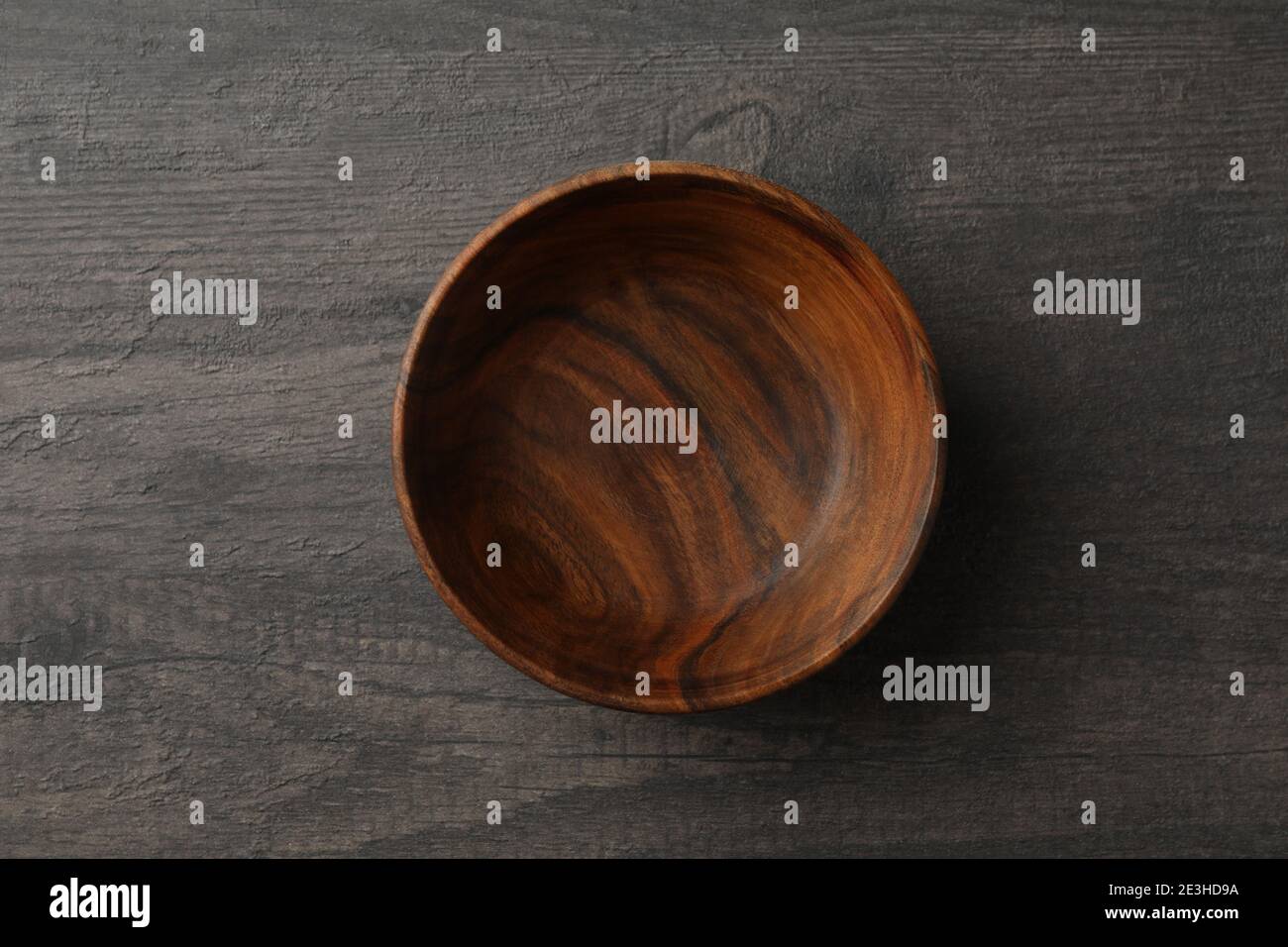 Empty wooden bowl on gray table, top view Stock Photo - Alamy