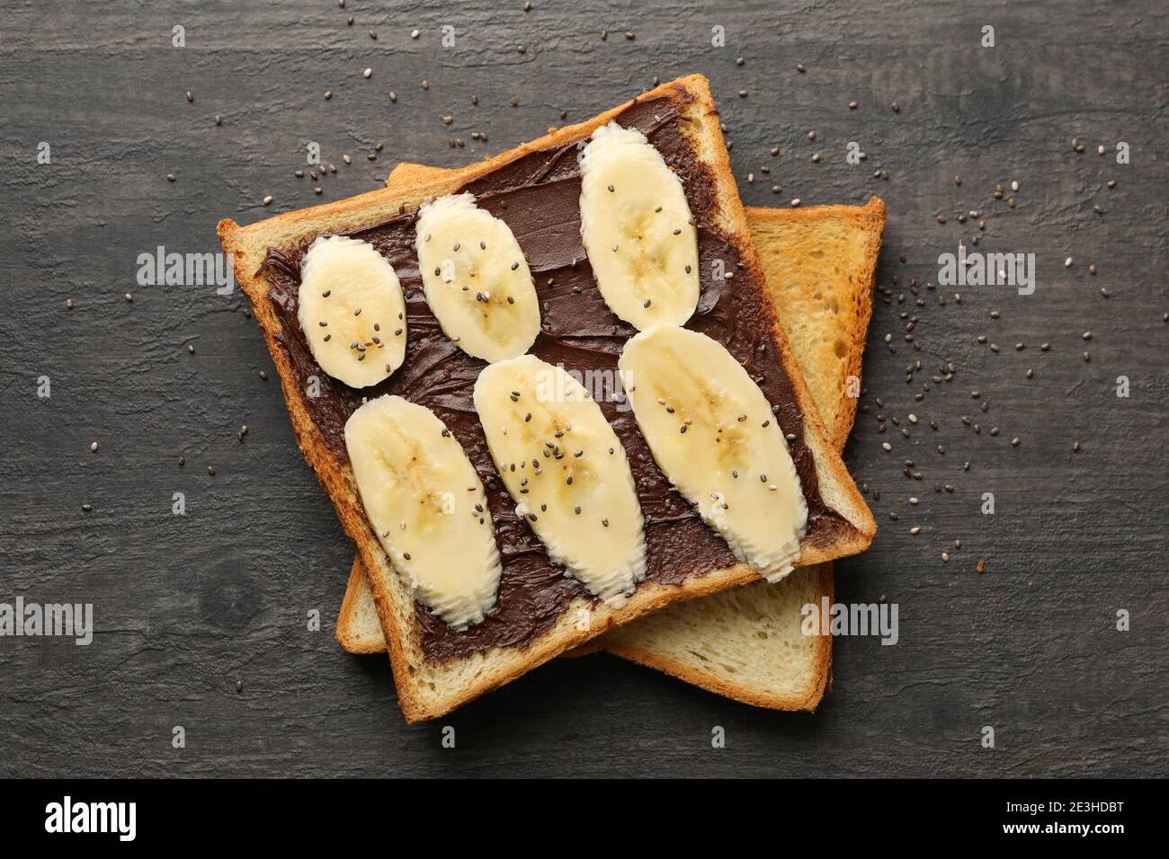 Sweet toast with banana on wooden background Stock Photo - Alamy