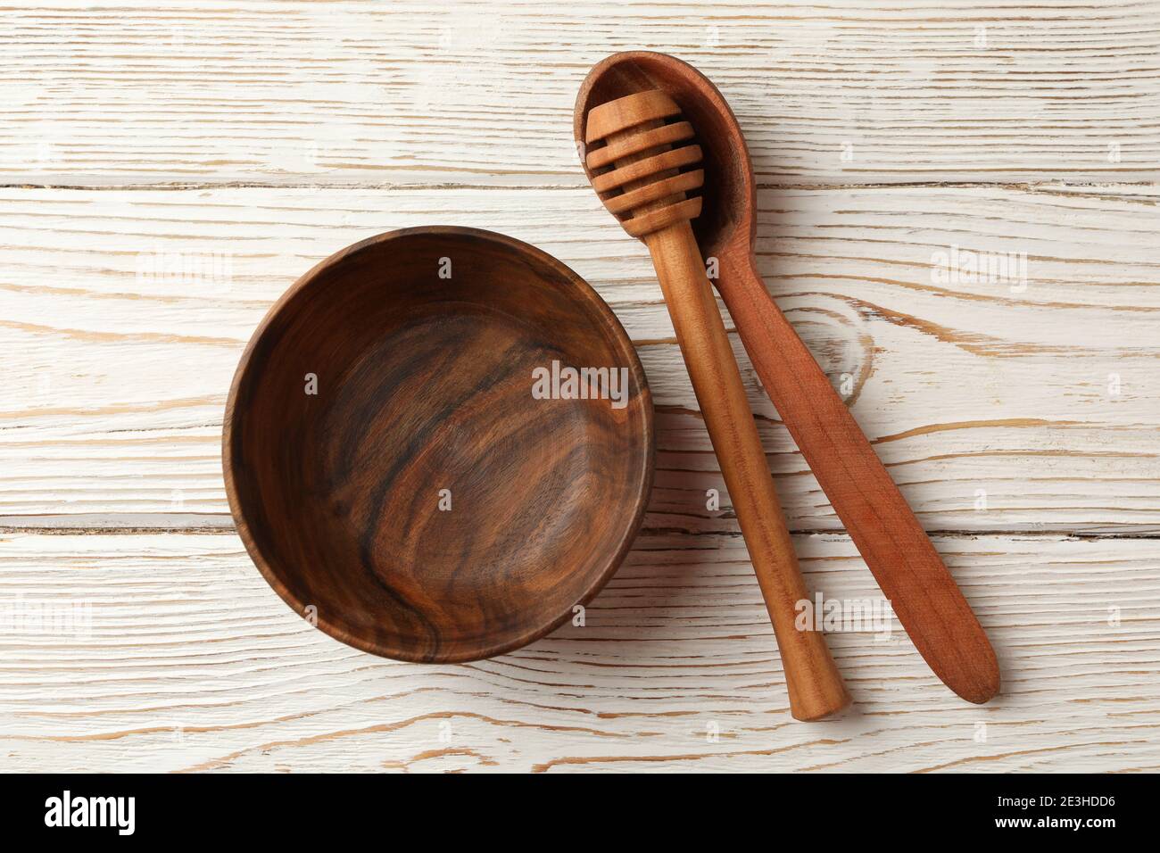 Bowl, dipper and spoon on white wooden background Stock Photo - Alamy