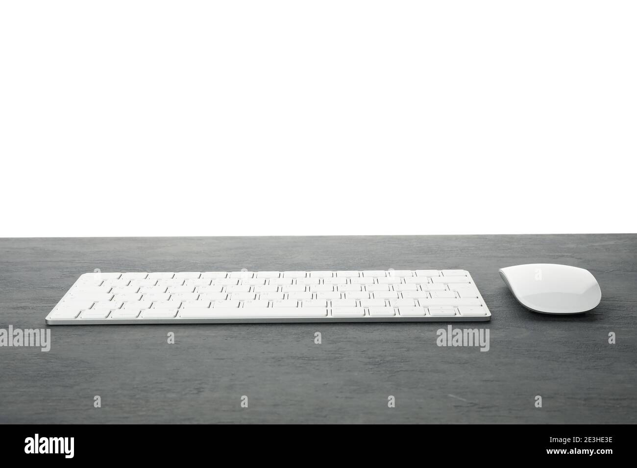 Keyboard and mouse on wooden table isolated on white background Stock ...