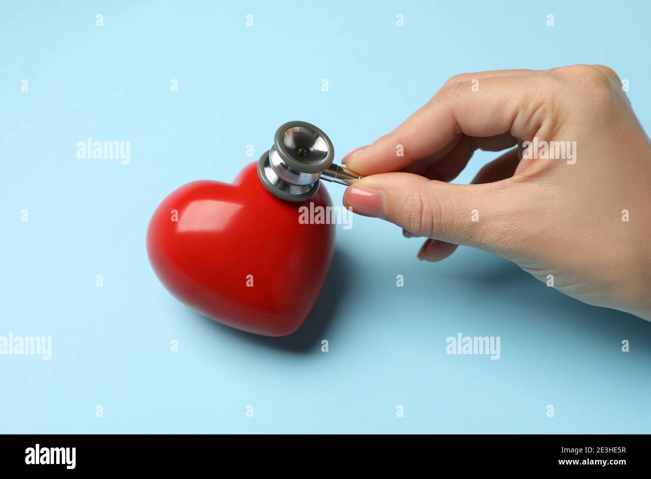 Female hand with stethoscope checking heart beat Stock Photo - Alamy