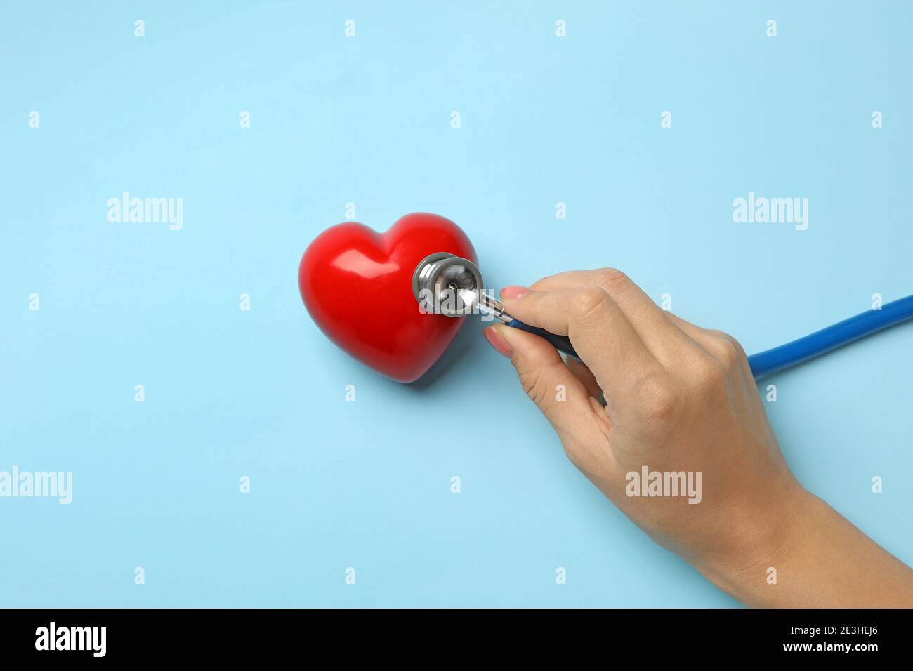 Female hand with stethoscope checking heart beat Stock Photo - Alamy