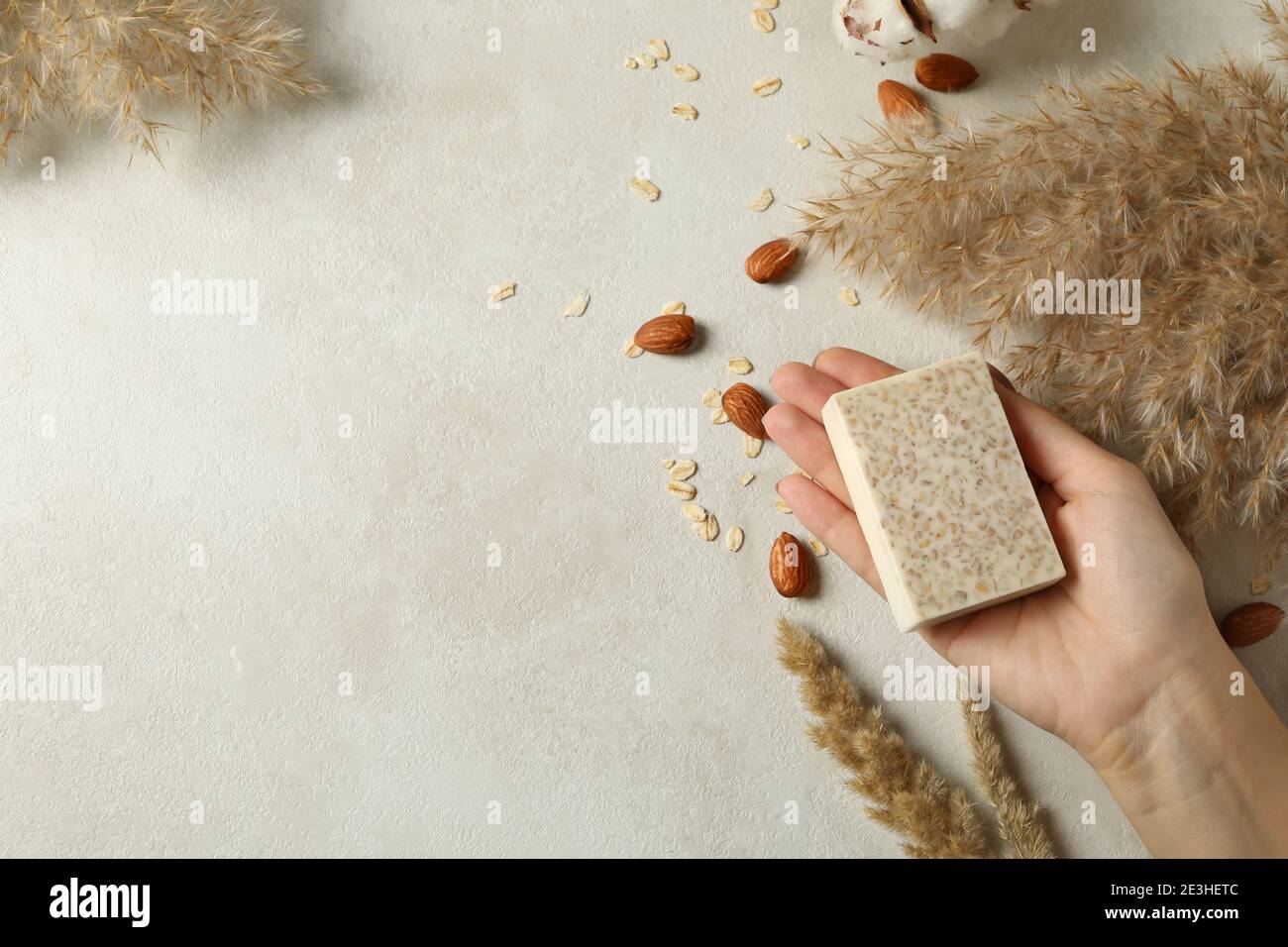 Female hand hold handmade soap on decorated background Stock Photo - Alamy