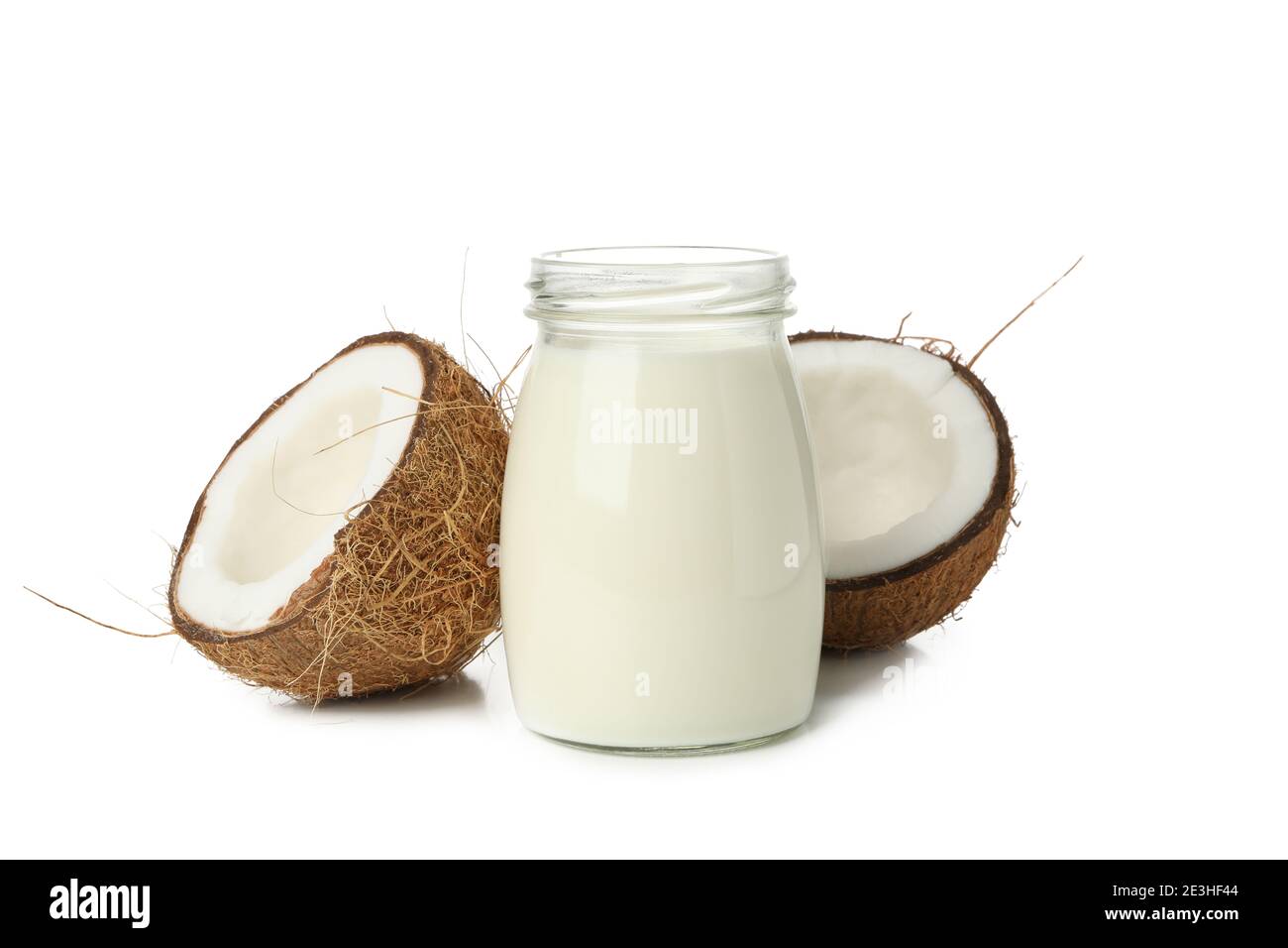 Coconut and jar of coconut milk isolated on white background Stock ...