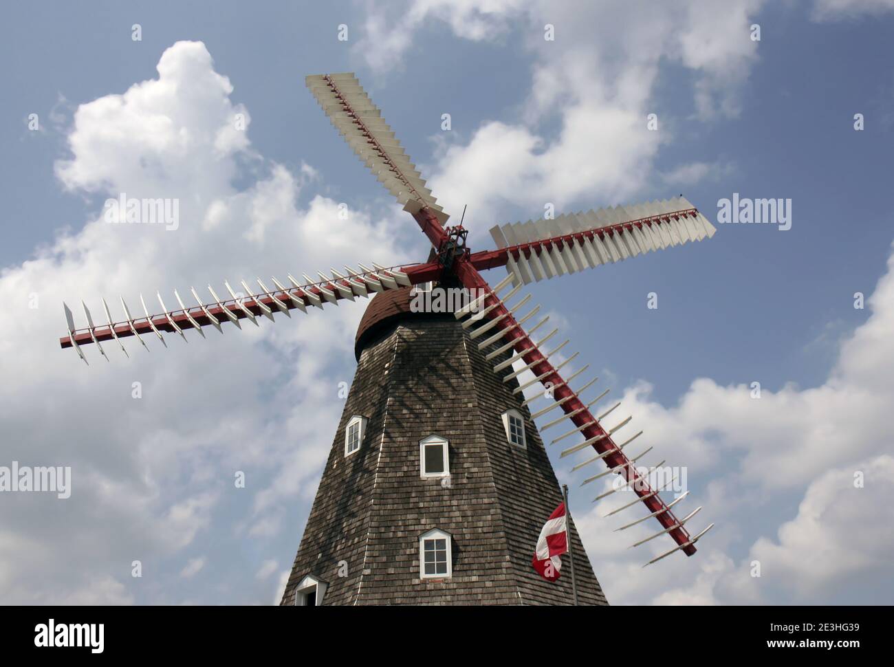 Old Danish Windmill with Danish Flag and Cloudy Sky Background Stock Photo - Alamy