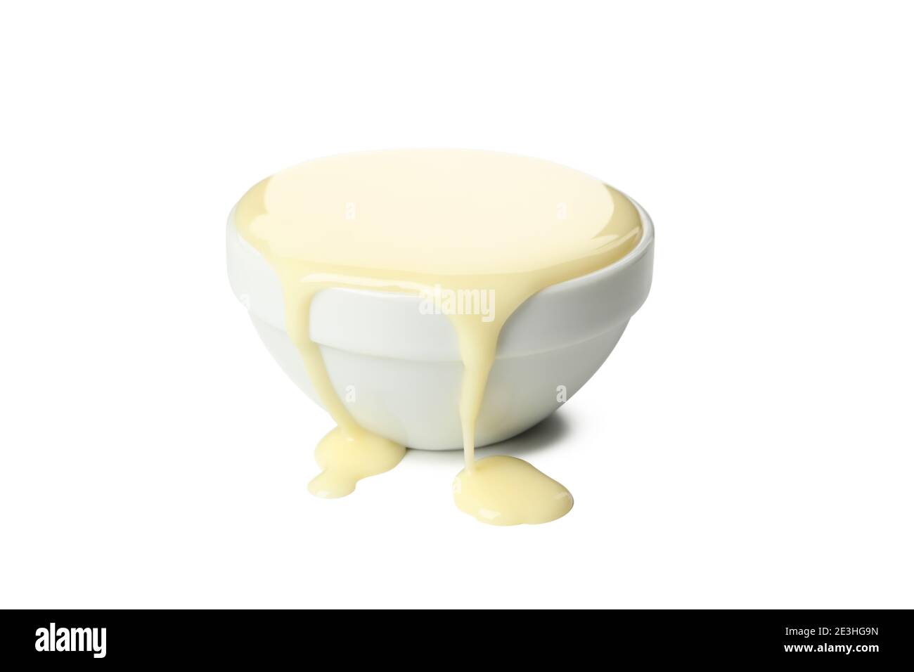 Bowl with condensed milk isolated on white background Stock Photo - Alamy