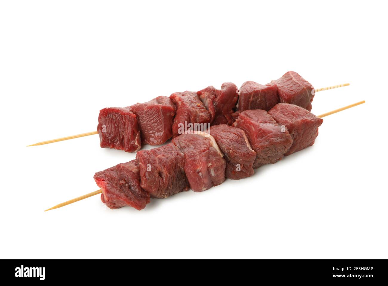 Skewers with raw meat isolated on white background Stock Photo - Alamy