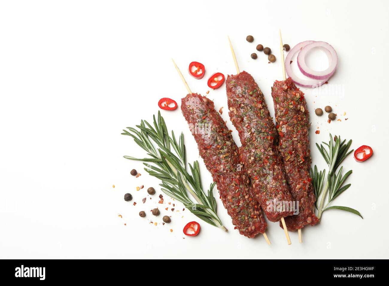 Raw lula kebab, herbs and spices on white background Stock Photo - Alamy