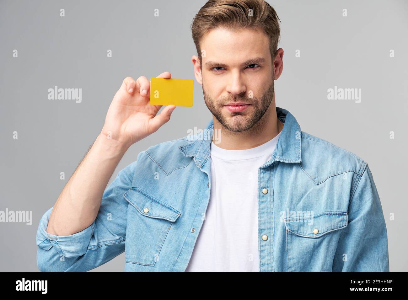 Successful man holding bank card hi-res stock photography and images ...