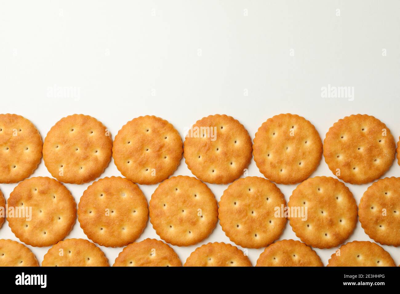 Flat lay with cracker biscuits on white background Stock Photo - Alamy