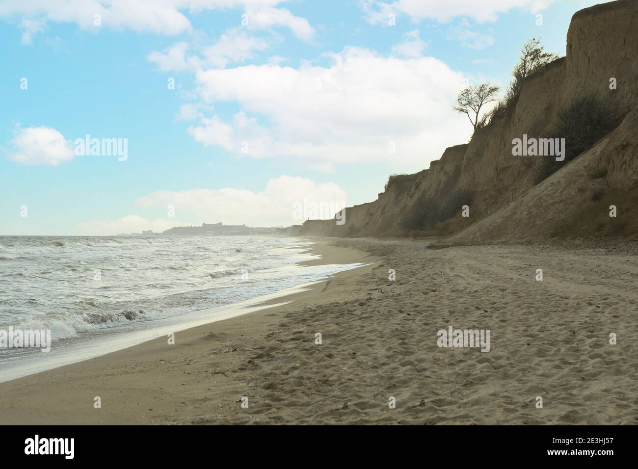 Sandy beach with clay slopes, space for text Stock Photo - Alamy