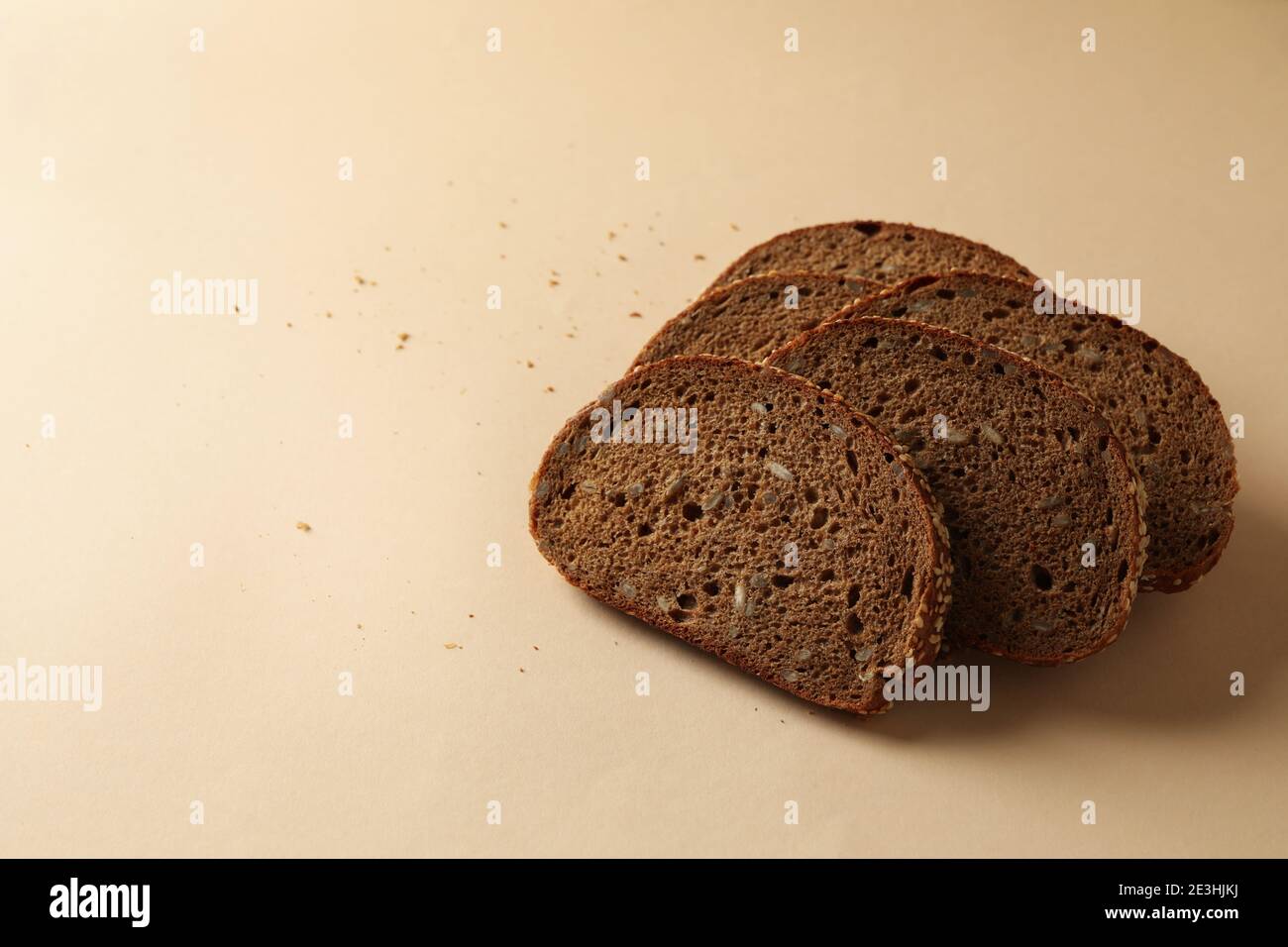 Fresh baked rye bread slices on beige background Stock Photo - Alamy