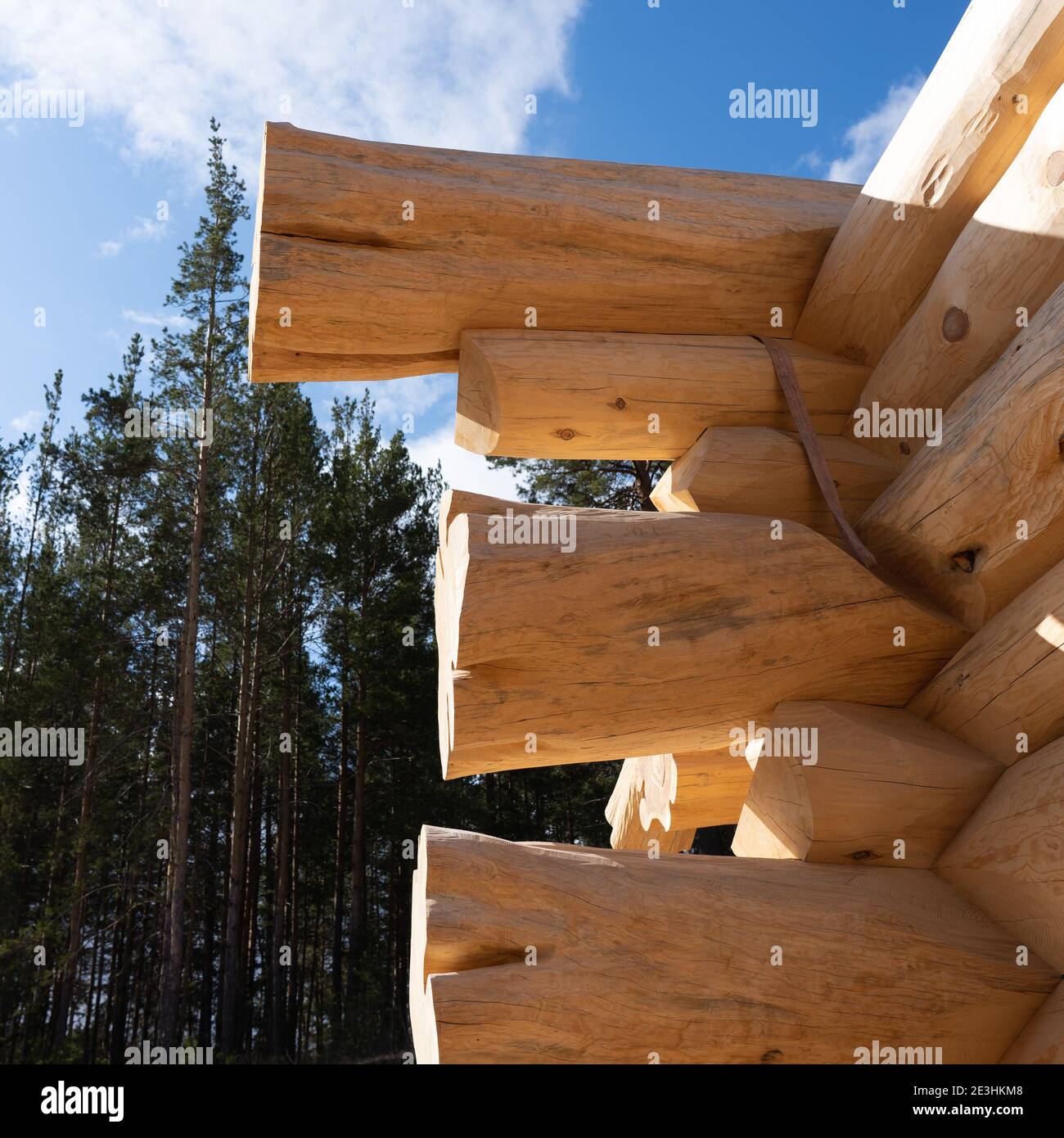 Making ethnic log houses in the open Stock Photo - Alamy