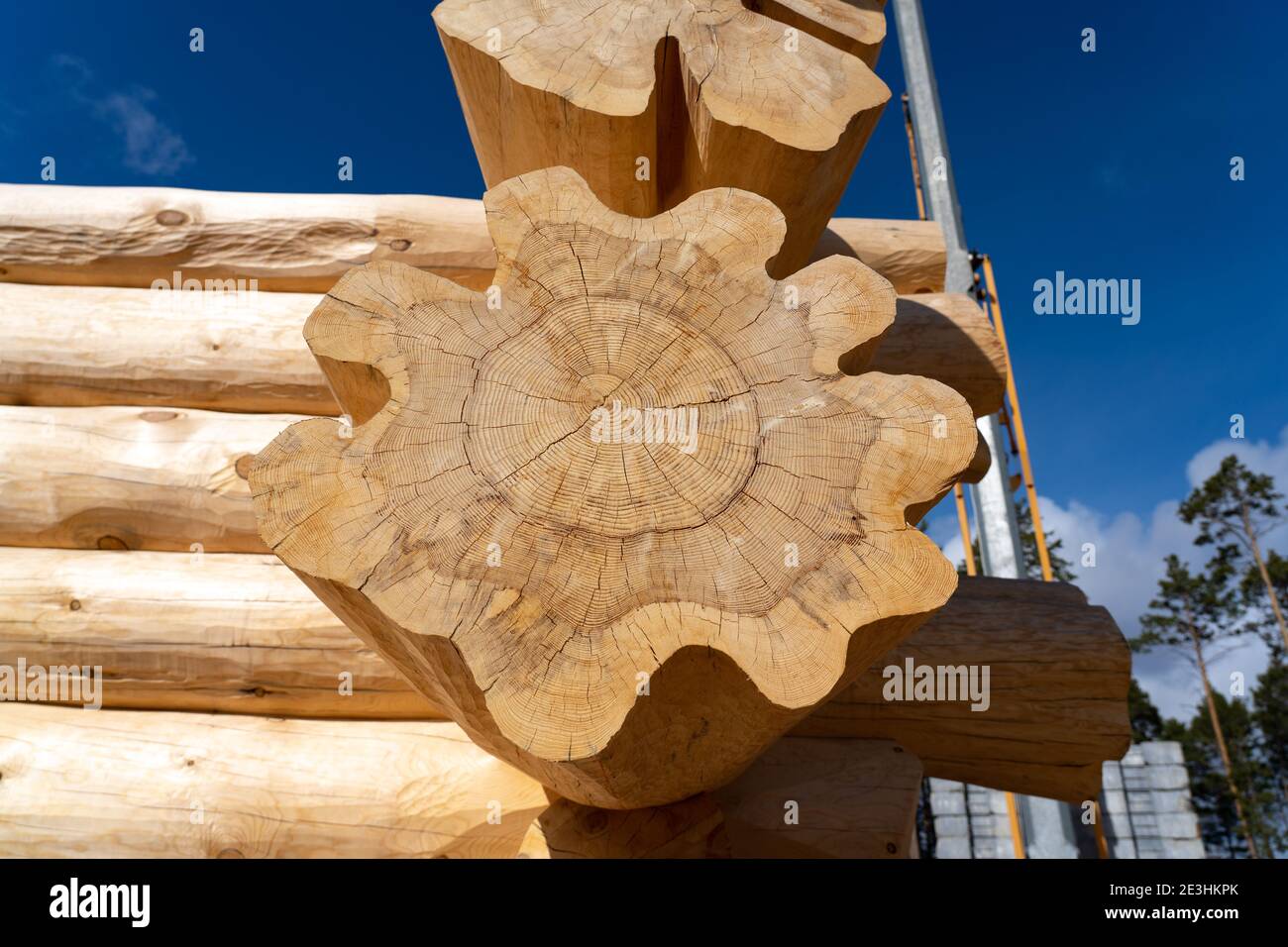Making ethnic log houses in the open Stock Photo - Alamy