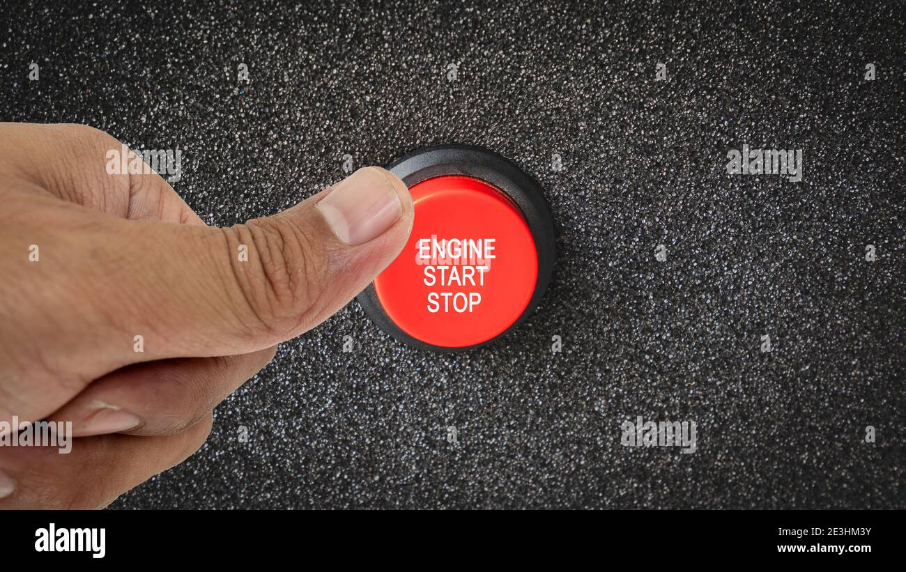 Close up on the finger pressing a button that indicates the start of ...