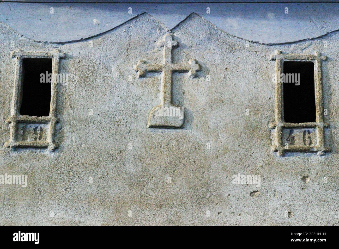 Brasov County, Romania. Facade of an old house with a bas-relief cross ...