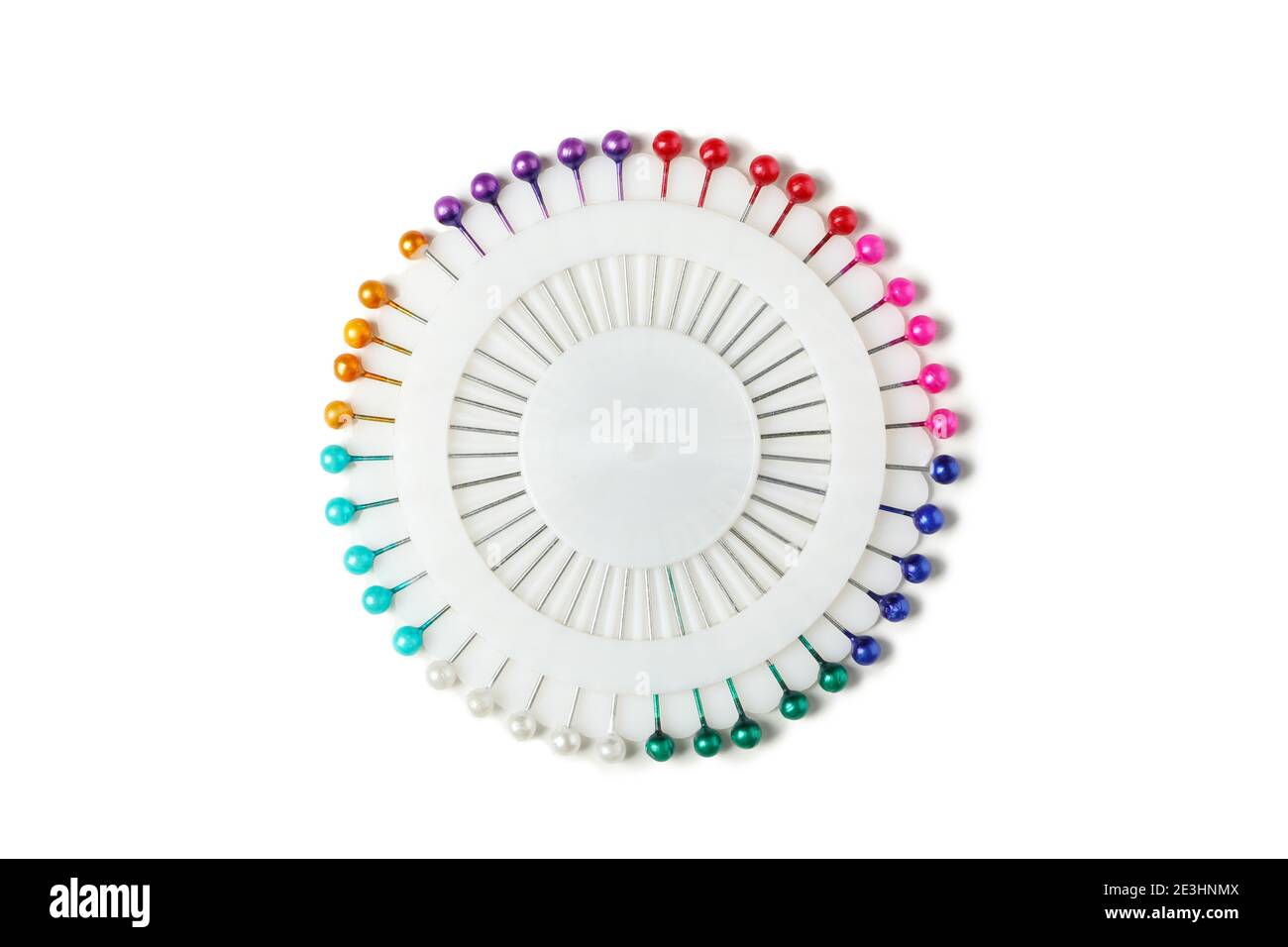 Multi colored needles isolated on white background Stock Photo - Alamy