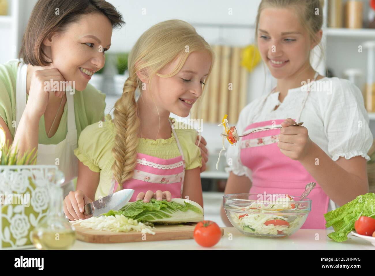 Mother cooking in kitchen hi-res stock photography and images - Alamy