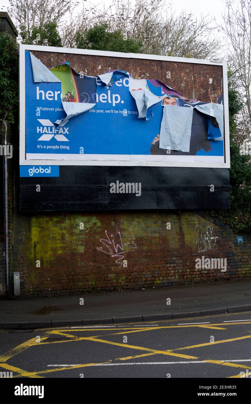 Torn roadside advertising hoarding, Coventry Road, Warwick ...
