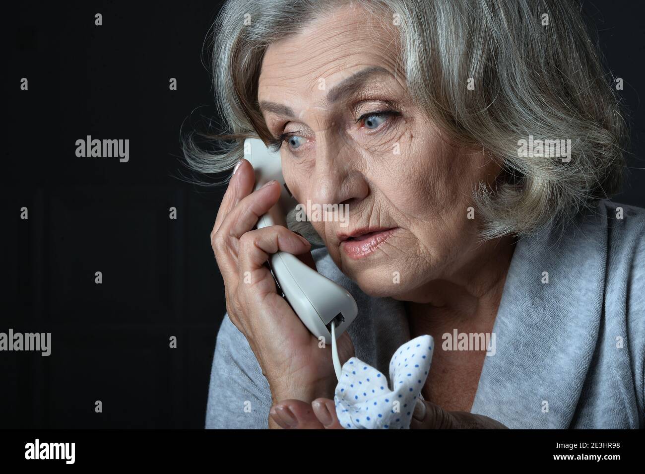 Pensive mature woman calling hi-res stock photography and images - Alamy