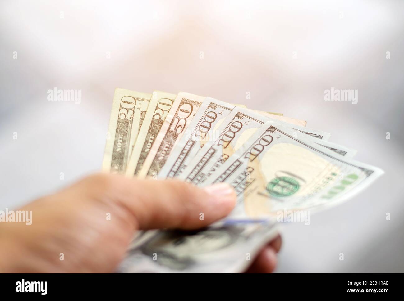 Counting 20 dollar bills hand hi-res stock photography and images - Alamy