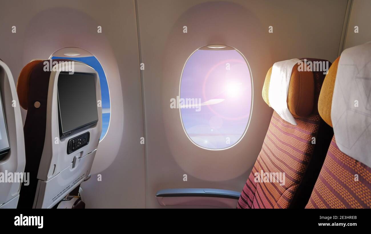 Closeup the window of the passenger plane and empty seats, concepts for ...