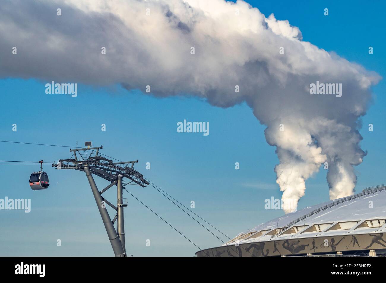 Russia, Moscow. Steam rises from cooling towers of a combined heat and ...