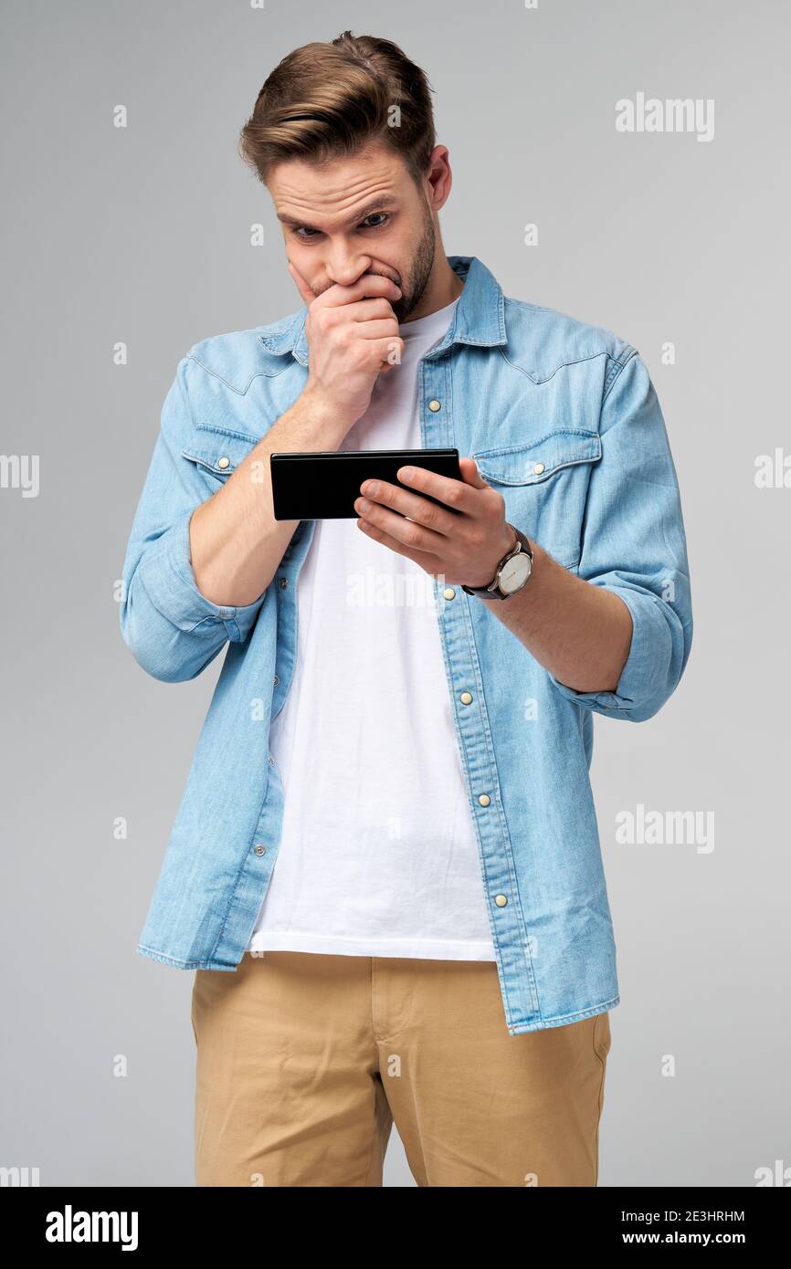 Man holding phone expression surprise hi-res stock photography and ...