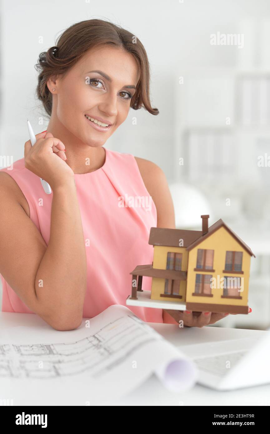 Beautiful female architect working in modern office Stock Photo - Alamy