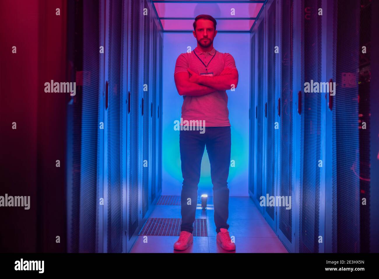Confident programmer standing in the data center Stock Photo - Alamy
