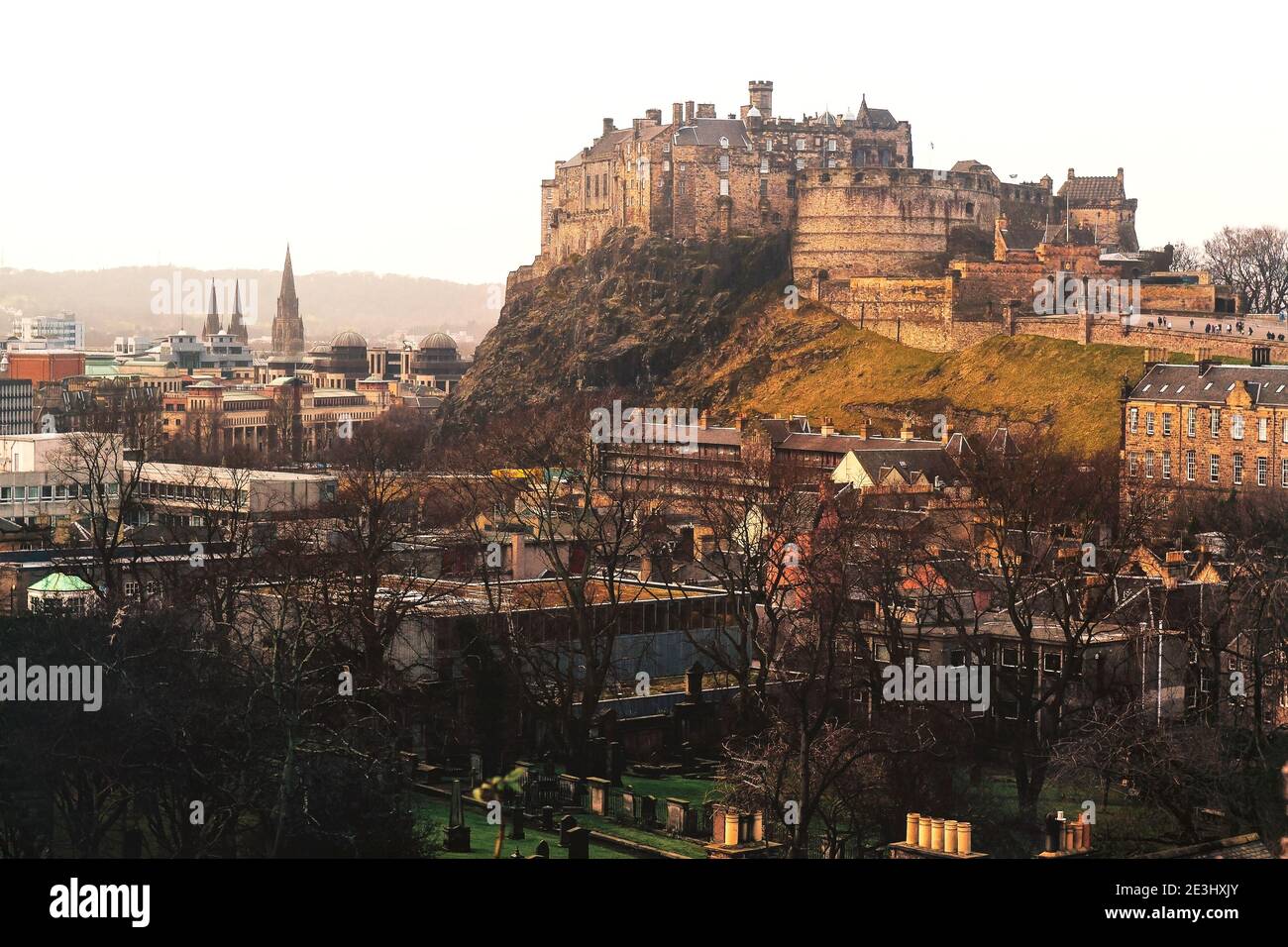 Edinburgh castle hill with spires and towers and modern buildings in ...
