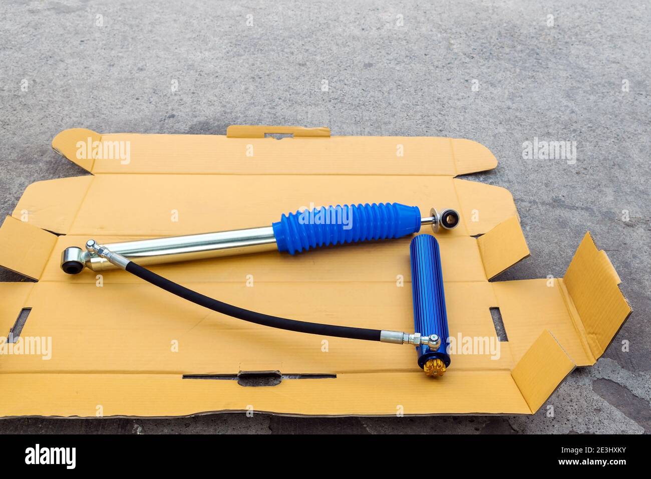 New shock absorber for the car was laid out on a paper box Stock Photo ...
