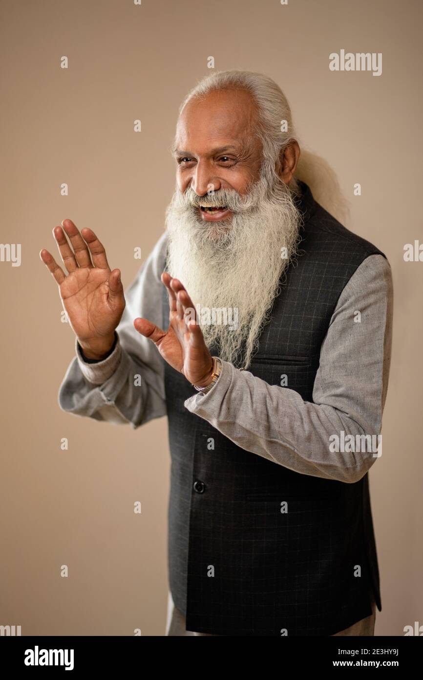 A SENIOR ADULT MAN HAPPILY TALKING WHILE LOOKING AWAY Stock Photo - Alamy
