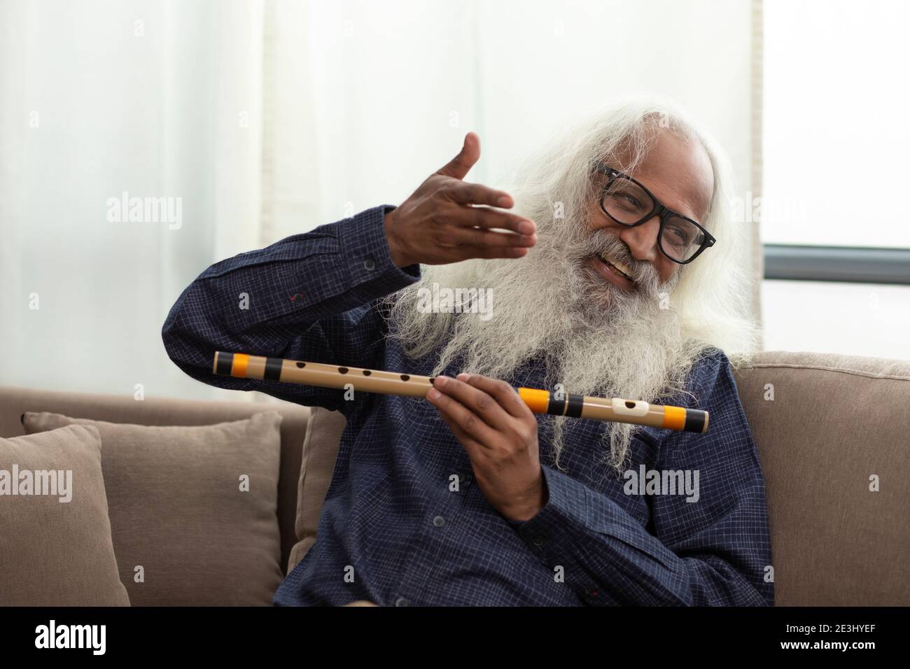 Indian Man Playing The Flute High Resolution Stock Photography and ...