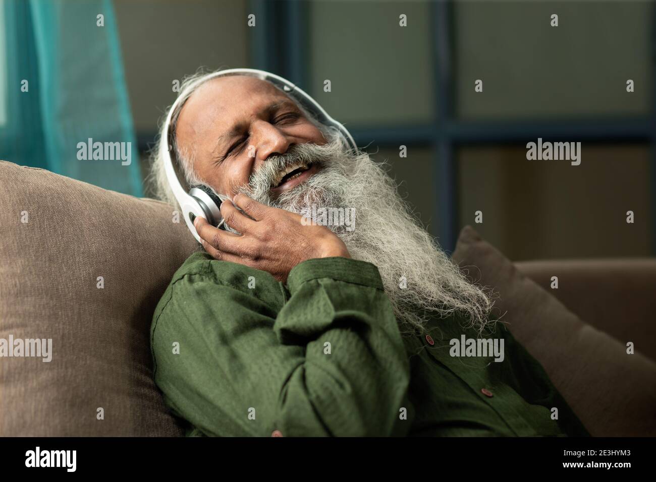 Indian old man listening music hi-res stock photography and images - Alamy