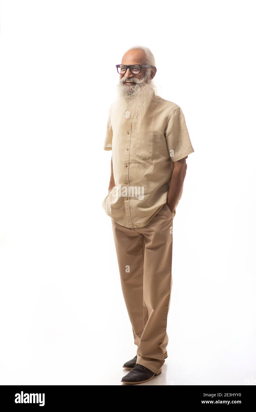 A HAPPY OLD MAN STANDING WHILE LOOKING AWAY Stock Photo - Alamy