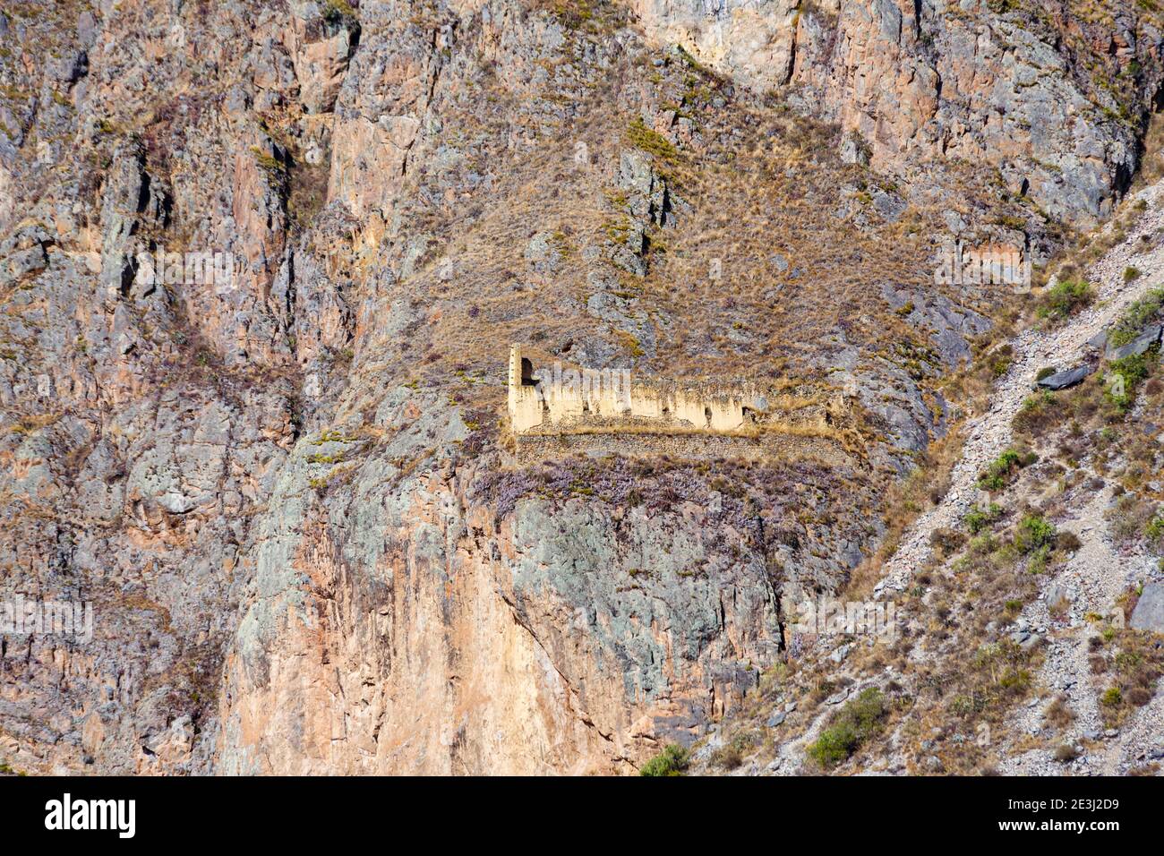 Mountainside qullqas (storehouses) on Pinkuylluna, Ollantaytambo, an ...
