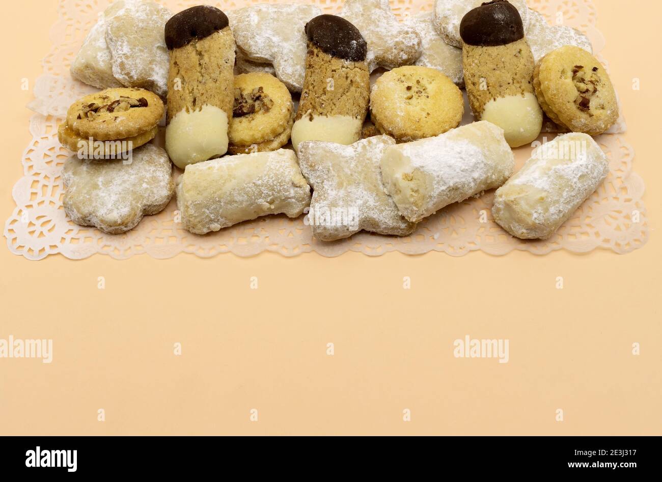 Bosnian Tea cookies of varied shapes and colors on a creamy background ...