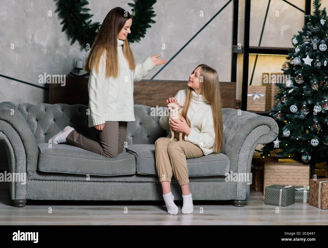 Two lovely girls posing with kissing face expression at birthday party ...