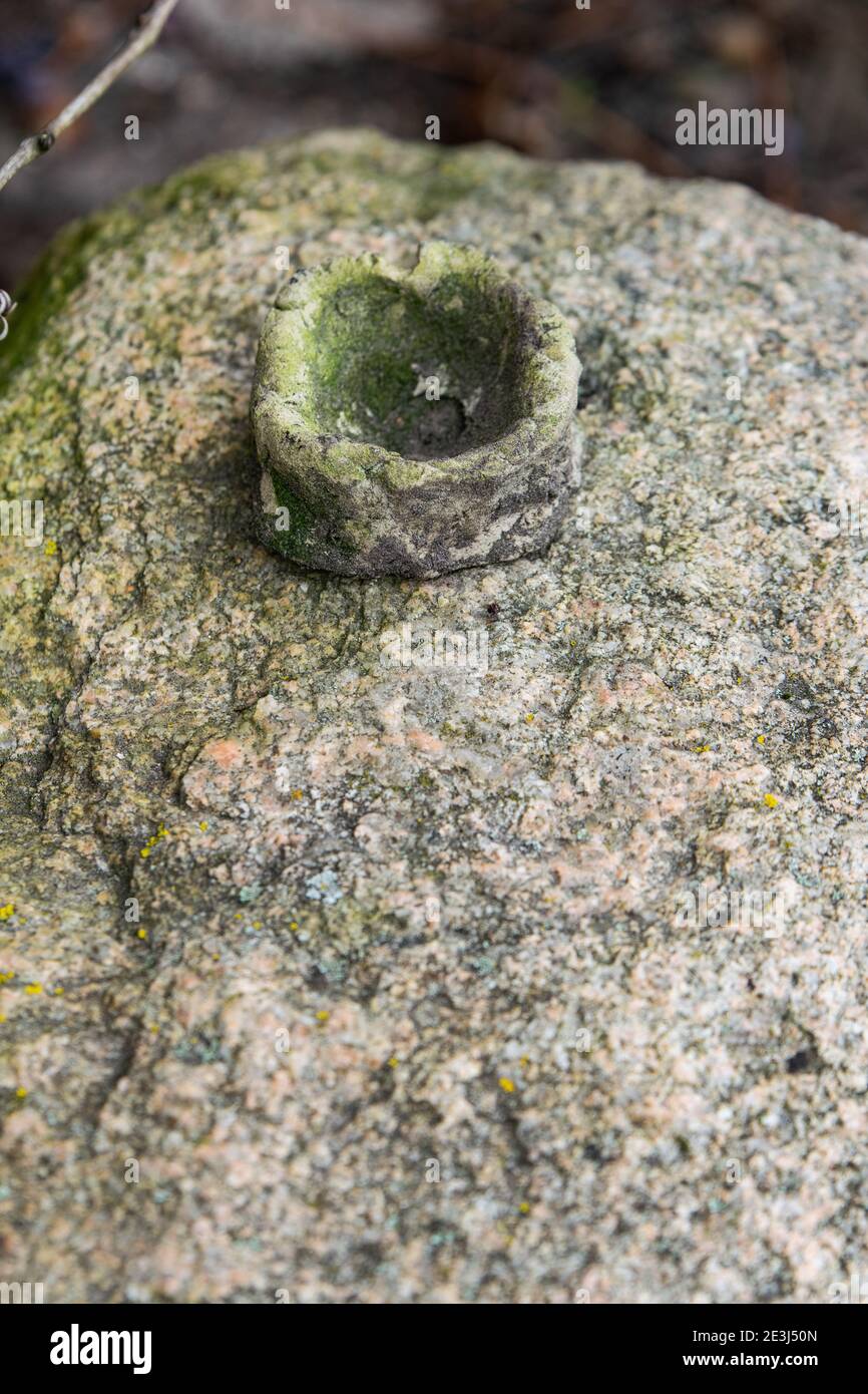 old clay pot on rock with moss Stock Photo - Alamy