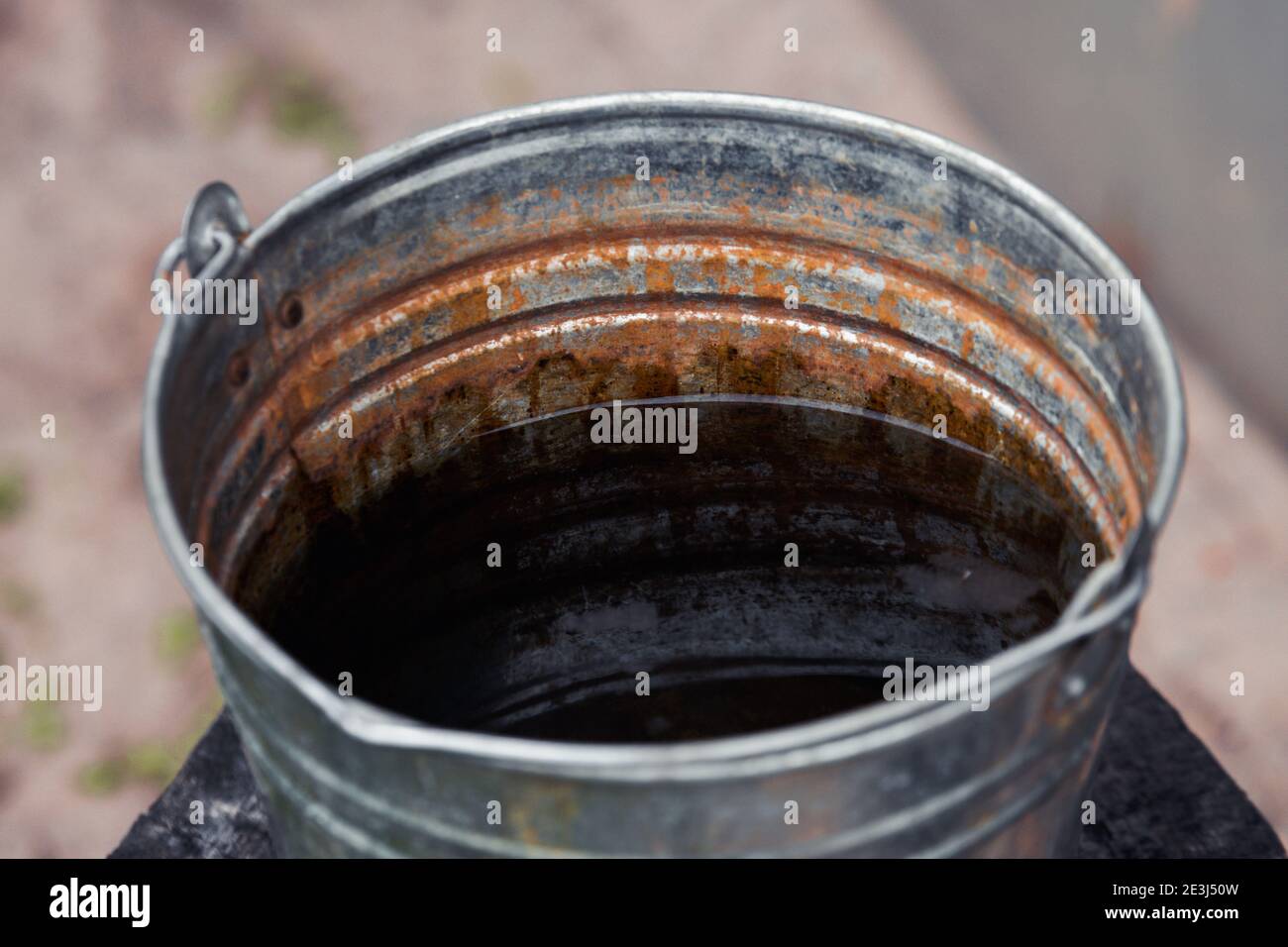 abandoned rusty metal water bucket Stock Photo - Alamy