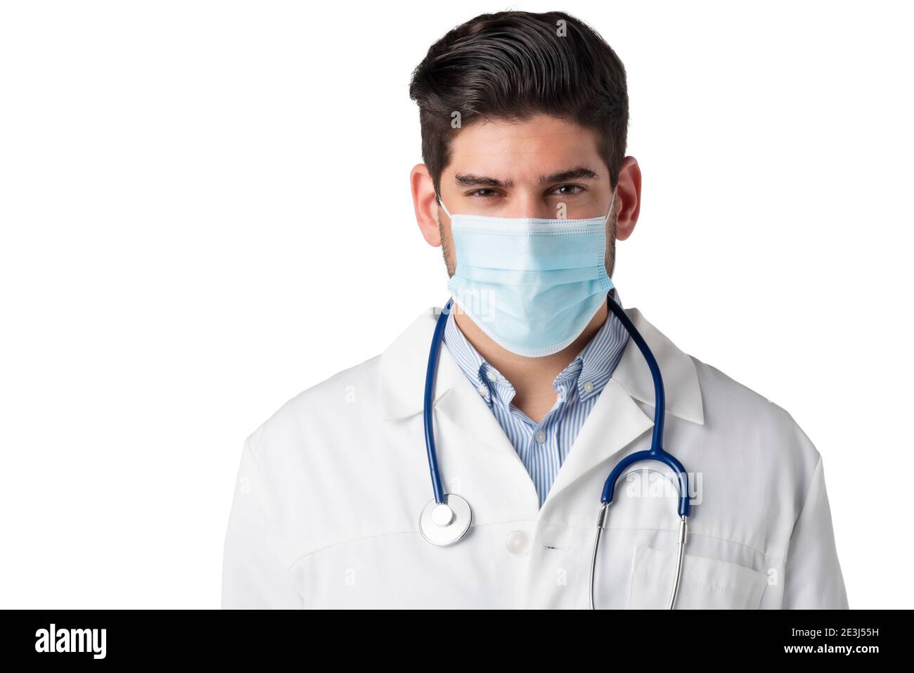 Close-up studio portrait of male doctor wearing face mask while ...