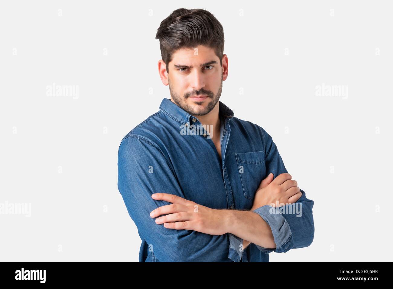 Portrait shot of serious faced businessman wearing shirt while standing ...