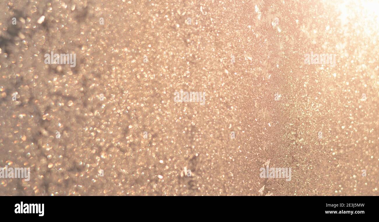 Shiny golden abstract background. Defocused sunlight through frosty ...