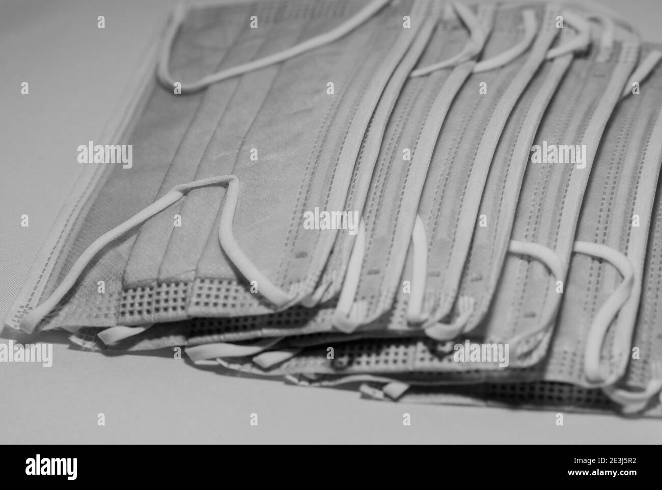 Stack of face masks in black and white Stock Photo - Alamy