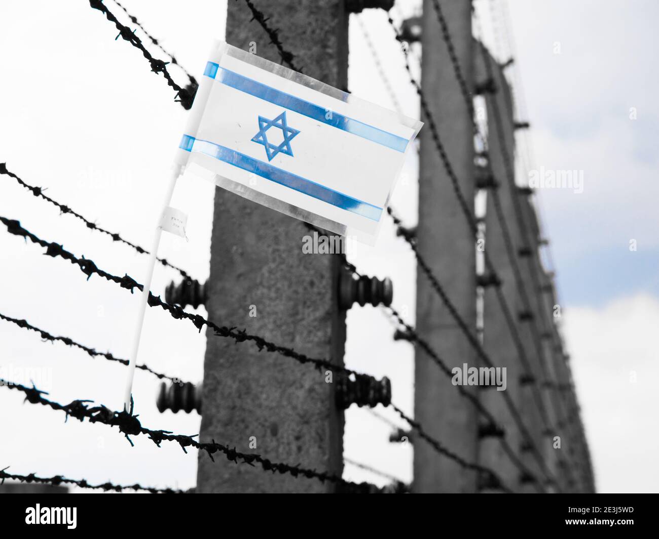 Small flag of Israel hanging on the barbwire in concentration camp ...